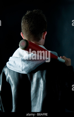 Young man with baseball bat fighting against death (grim reaper) with ...