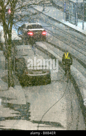 A commuter driving in a winter snow storm Stock Photo - Alamy