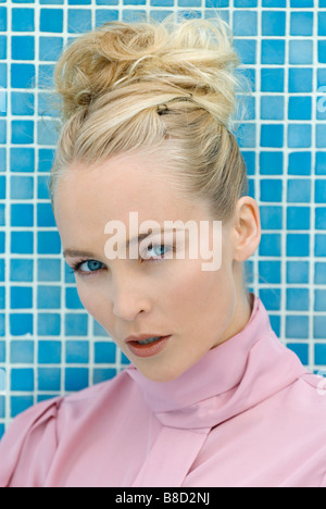 Young beautiful blonde and blue eyes woman wearing blue t-shirt over ...
