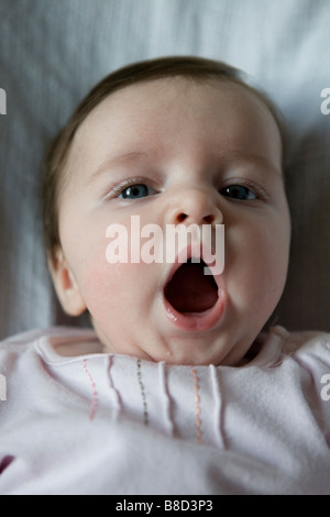 baby yawn yawning mouth open face head portrait caucasian girl female ...