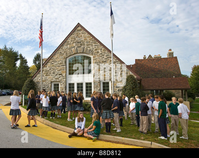 Students gathered around the flagpole at a private school Stock Photo ...