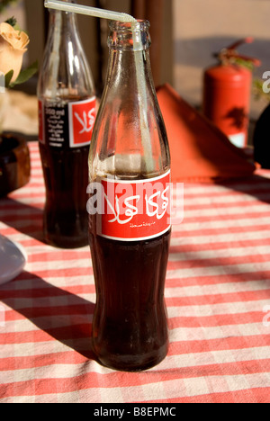 Half full Coca-Cola bottle Stock Photo - Alamy