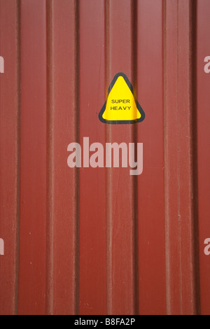 Caution sign on a shipping container Stock Photo - Alamy
