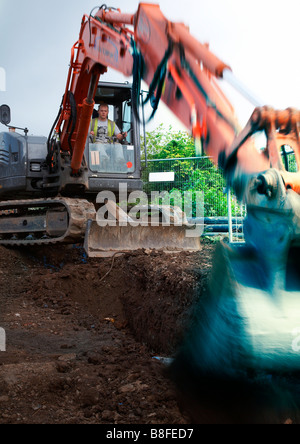 JCB Digger excavator digging trench for field drainage pipes Stock ...