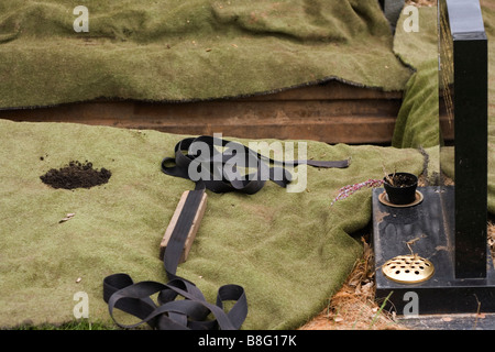 A freshly dug grave ready for a body to be placed into it Stock Photo ...