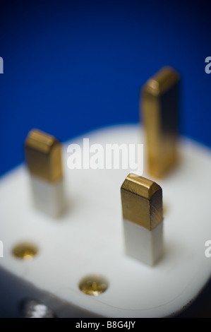 A 240 volt British electrical plug on a blue background Stock Photo - Alamy