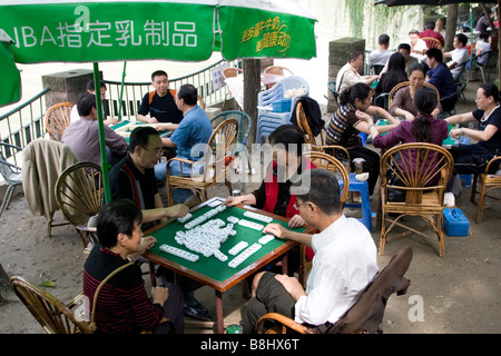 People playing mahjong and drinking tea at a teahouse Baihuatan Park ...