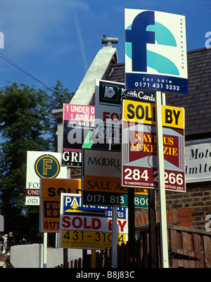 Estate agent's for sale signs in Bukchurst Hill, Essex, England, UK ...