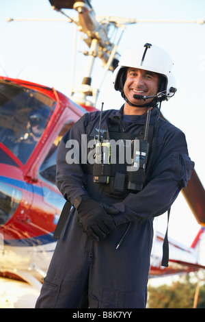 Portrait of happy smiling man paramedic in front of ambulance Stock ...