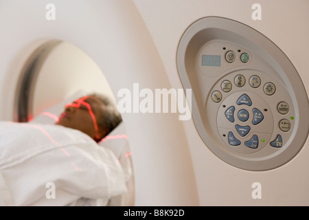 Computed Axial Tomography scan. Adult woman having CT scan procedure ...