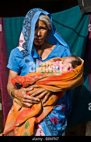 Indian grandmother and baby boy in a rural indian village. Andhra ...