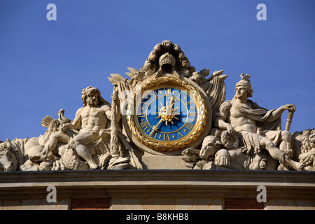 France, Versailles, Palace of Versailles, Detail of the clock on top of ...
