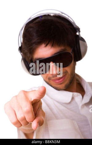 Man listening to music and pointing with his finger Stock Photo - Alamy