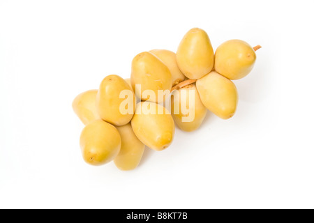 Fresh yellow dates isolated on a white studio background Stock Photo ...