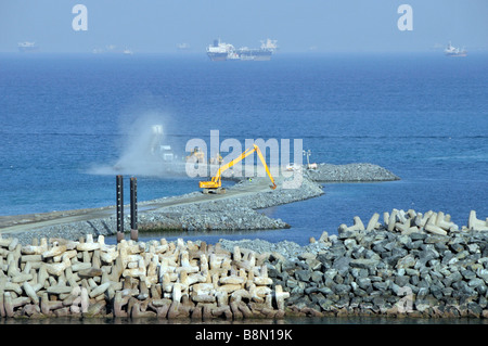 Coastal defences. Precast concrete blocks along a shore. This type of ...