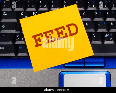 Memo note on notebook, Feed Stock Photo - Alamy