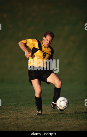 Football player in white kicking against argentina flag in grunge ...