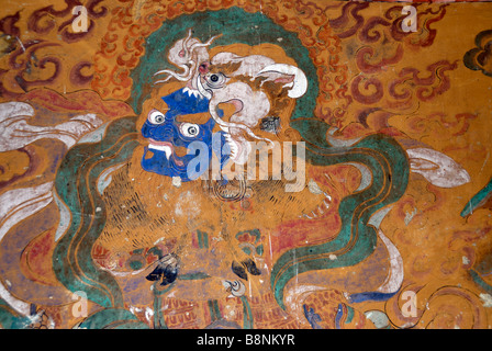 Ancient mural painting of a three-eyed demon. The demon has various ...