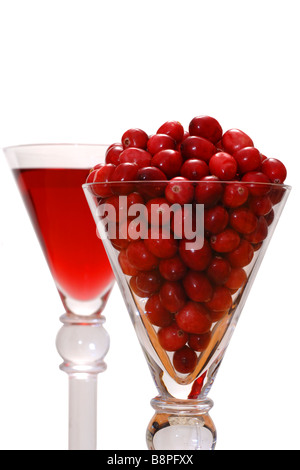 Fresh cranberries and cranberry berry cut in half isolated on white ...