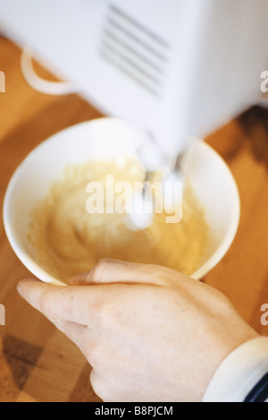 hand holds Electric mixer Stock Photo - Alamy