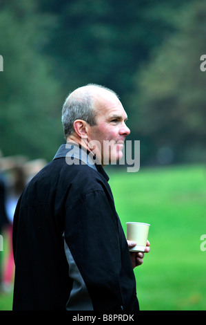 Middle-aged man holding a plastic bottle Stock Photo - Alamy