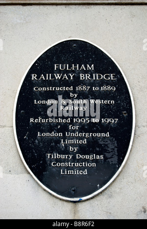 plaque on fulham railway bridge, crossing the river thames in london ...