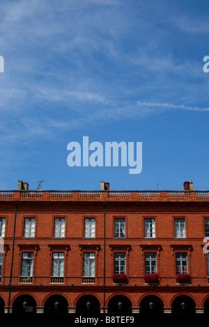 The pink brick buildings surrounding Place du Capitole in Toulouse, in ...