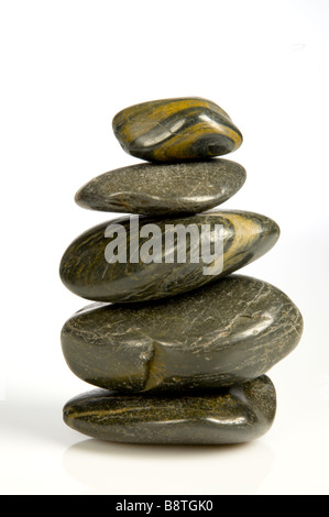 A pile of smooth, shiny river rocks on a white background Stock Photo ...