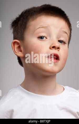 Little boy with quizzical facial expression Stock Photo - Alamy