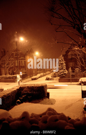 night snowing snow scene street lighting amber Stock Photo - Alamy