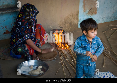 Children in traditional clothes and golden paper headdresses and medals ...