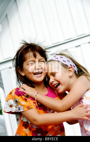 Two girls hugging, Sweden Stock Photo - Alamy