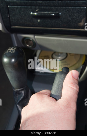 Hand pulling the car handbrake on a automatic gear car Stock Photo - Alamy