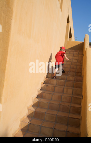 BOY RUNNING UP STAIRS Stock Photo - Alamy