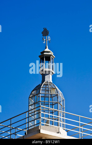 Lighthouse metallic and glass dome structure detail under blue sky ...