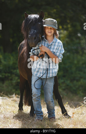 child and Shetland Pony Stock Photo - Alamy