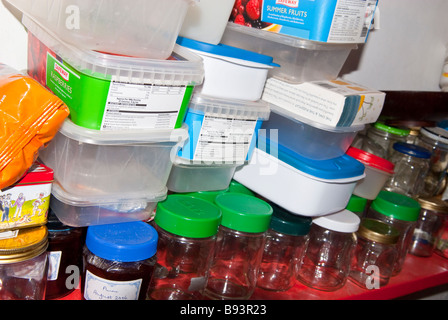 A cluttered untidy larder pantry housing lots of tins of food Stock ...