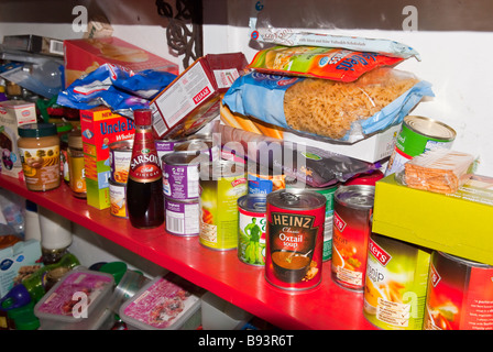 A cluttered untidy larder pantry housing lots of jars and empty food ...