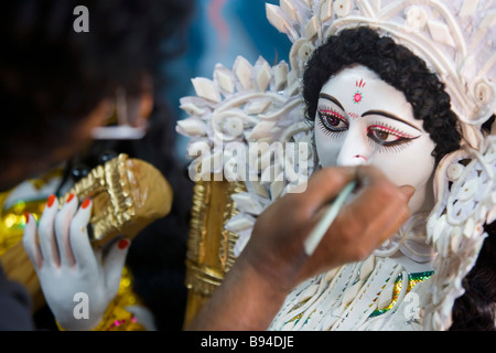 Sarasvati (Female Hindu God) idol being carried through street in ...