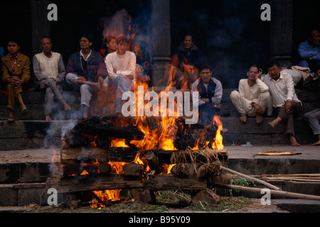 hindu funeral pyre for cremation in progress by the bagmati river Stock ...