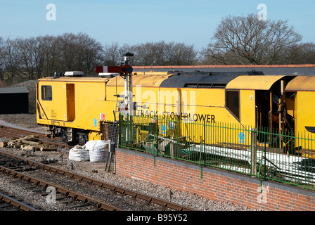 Railway maintenance stone blower and tamping machine Stock Photo - Alamy