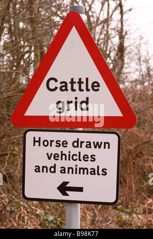 Cattle grid warning sign with arrow and information for horses and ...