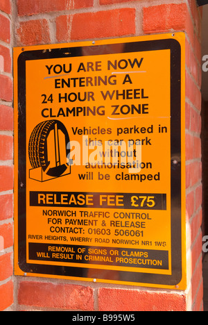 Warning sign , wheel-clamp area, Singapore Stock Photo - Alamy