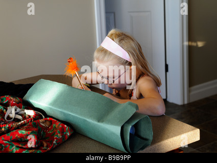 Beautiful girl is writing a homework or doing a notes in a notebook on ...