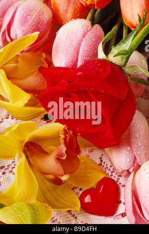 Bouquet of flowers with heart shapes on wooden table Stock Photo - Alamy
