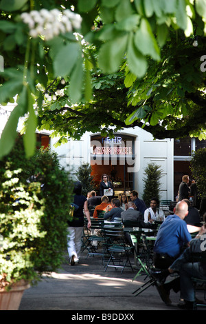 Guests sitting outside the bar Campari at Theaterplatz Basel Canton ...
