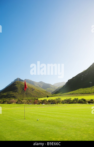 Golf Course Landscape with Red Flag Stock Photo - Alamy