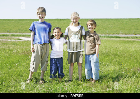 Children four meadow stands cheerfully detail series people girl boys ...