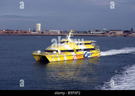 The Fast Cat ferry leaving Portsmouth harbour Stock Photo - Alamy