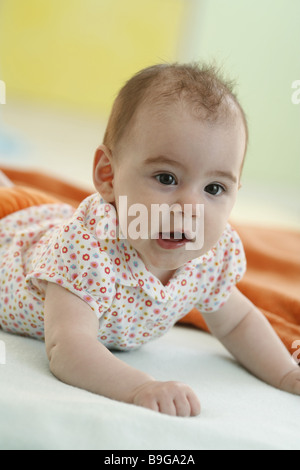 Baby lying prone position arm portrait rest Stock Photo - Alamy